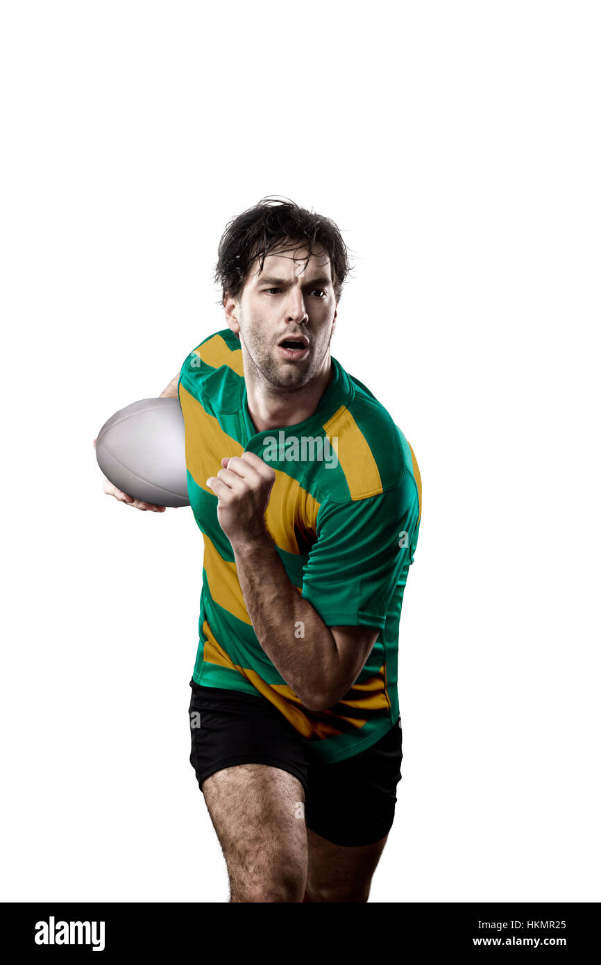 Rugby player in a green and gold uniform running. White Background ...