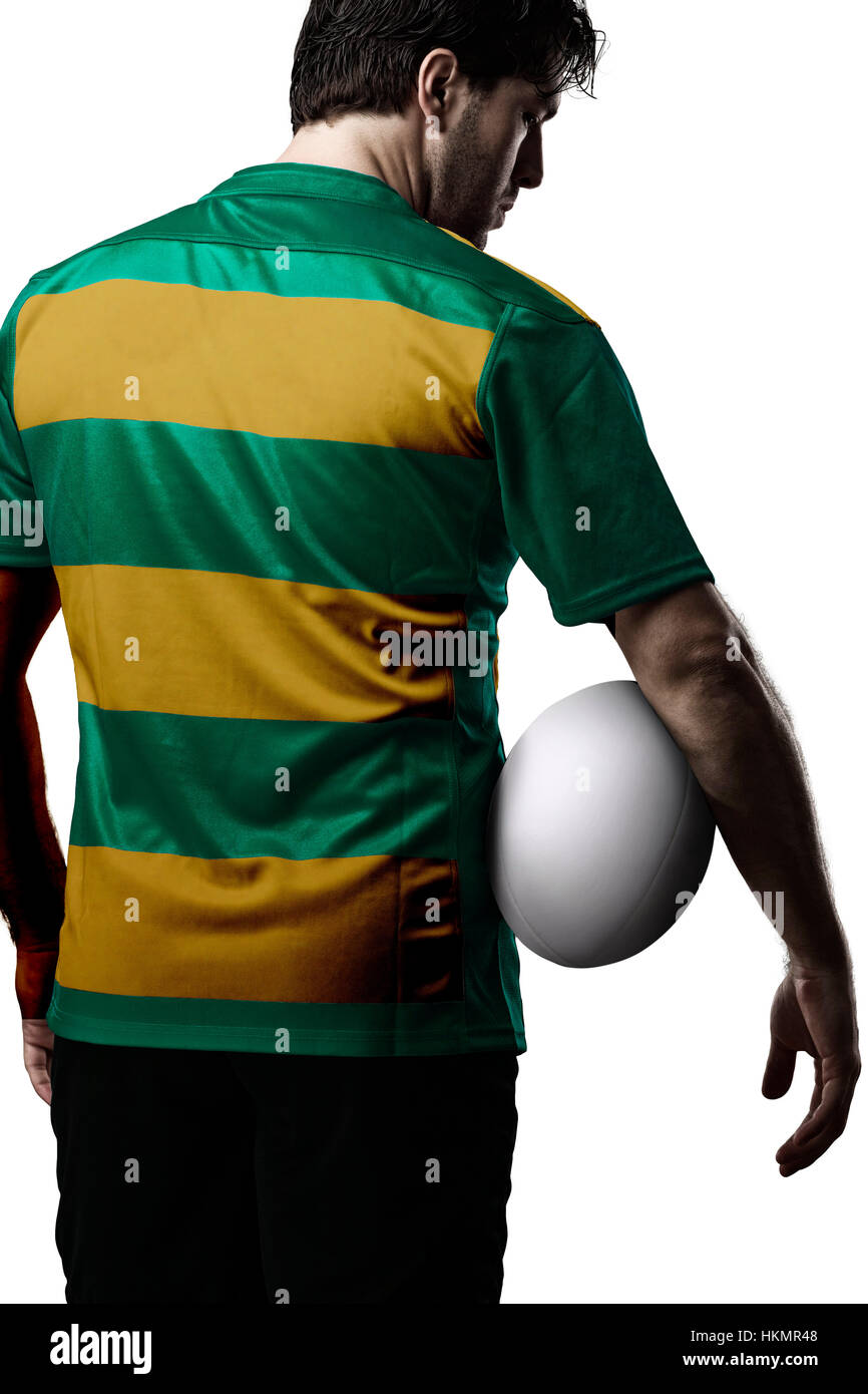 Rugby player in a green and gold uniform. White Background Stock Photo ...