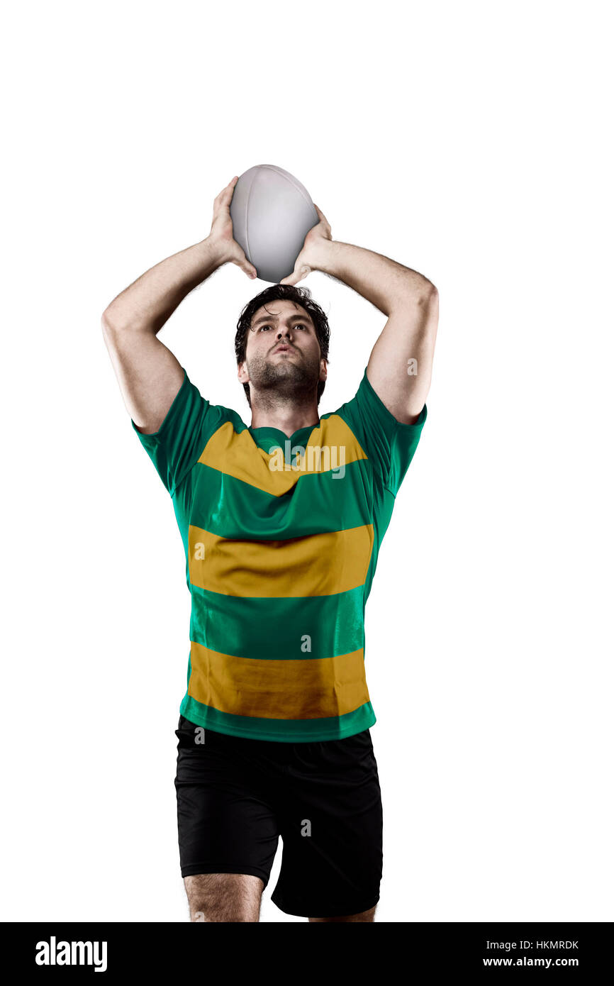 Rugby player in a green and gold uniform. White Background Stock Photo ...