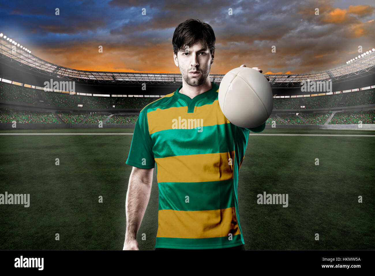 Rugby player in a green and gold uniform on a stadium Stock Photo - Alamy