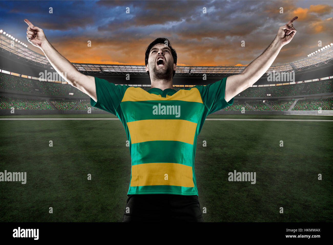 Rugby player in a green and gold uniform celebrating on a stadium Stock ...