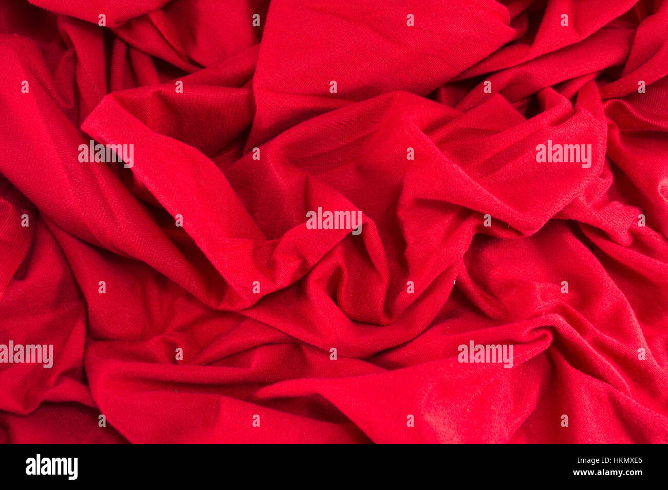 Red wrinkled fabric forming a background pattern Stock Photo - Alamy