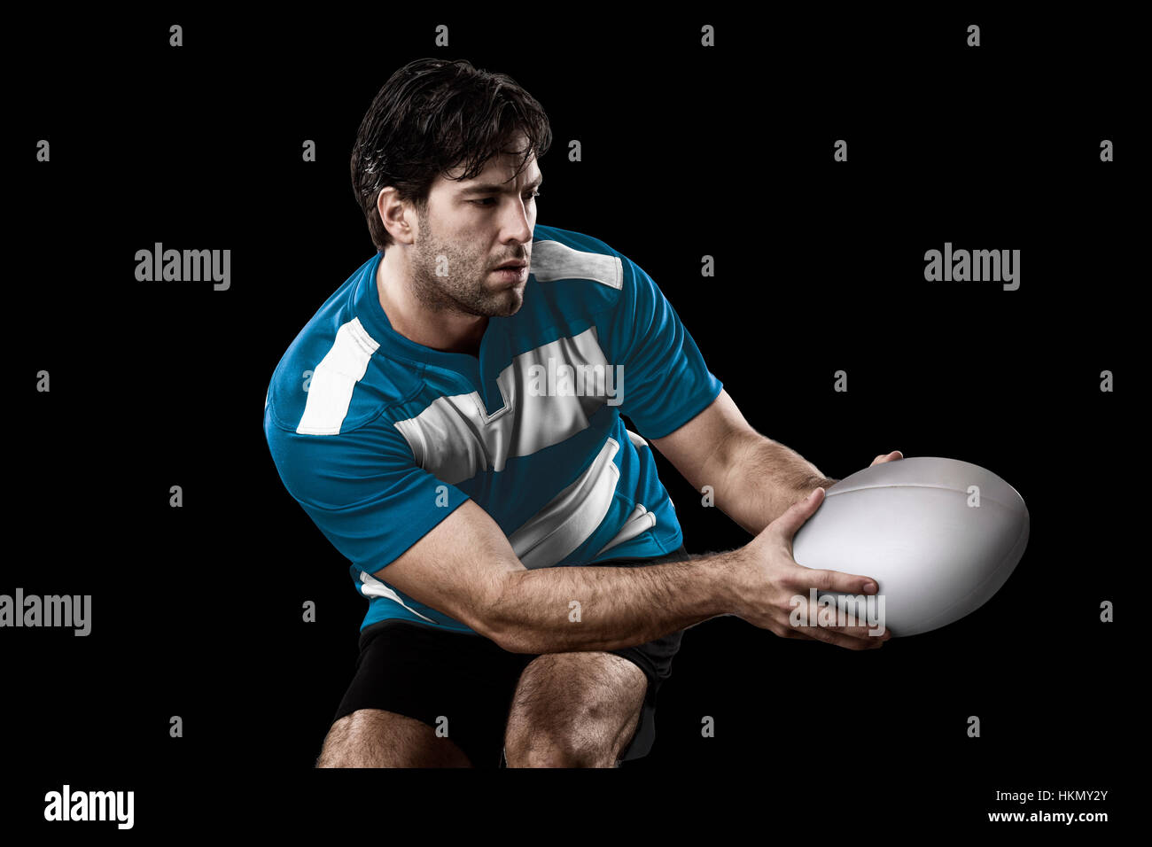 Rugby player in a blue uniform. black Background Stock Photo - Alamy