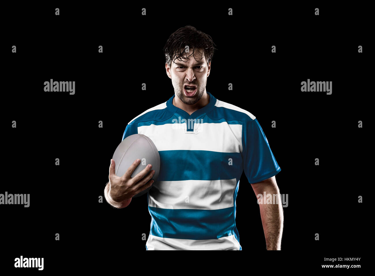 Rugby player in a blue uniform. black Background Stock Photo - Alamy