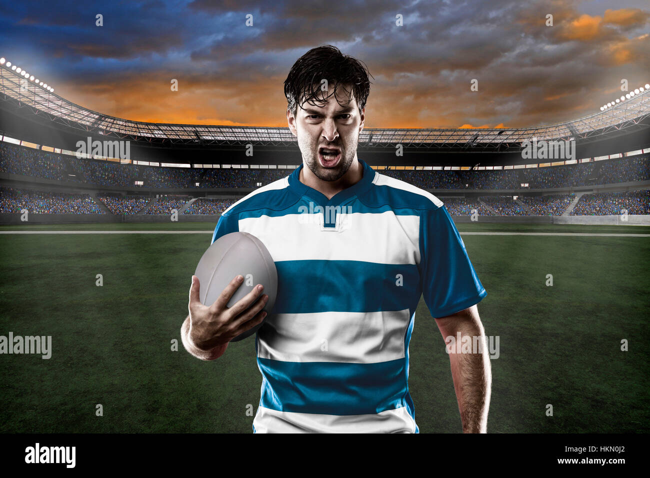 Rugby player in a blue uniform on a stadium Stock Photo - Alamy