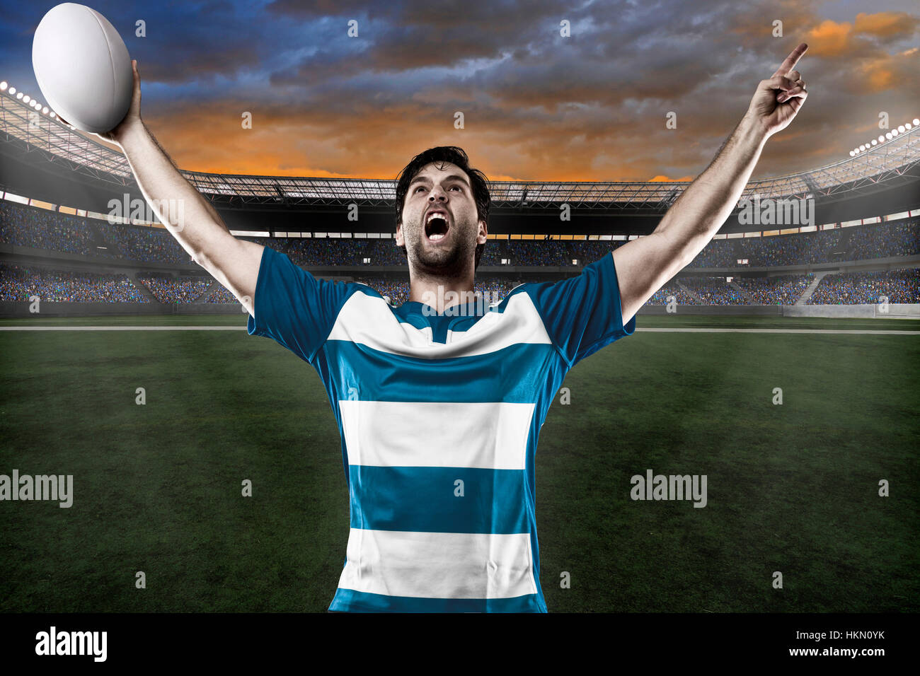Rugby player in a blue uniform celebrating on a stadium Stock Photo - Alamy