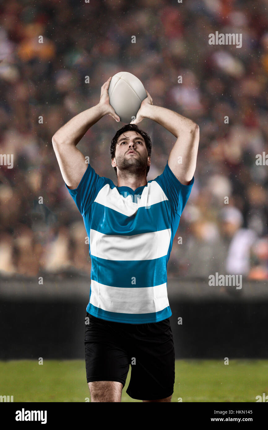 Rugby player in a blue uniform on a stadium Stock Photo - Alamy