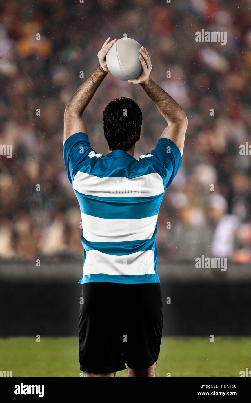 Rugby player in a blue uniform on a stadium Stock Photo - Alamy