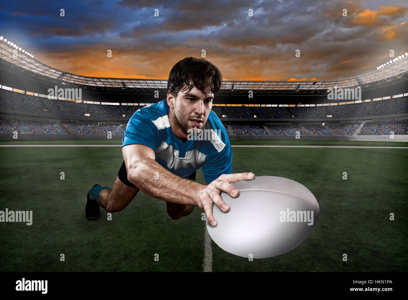 Rugby player in a blue uniform on a stadium Stock Photo - Alamy
