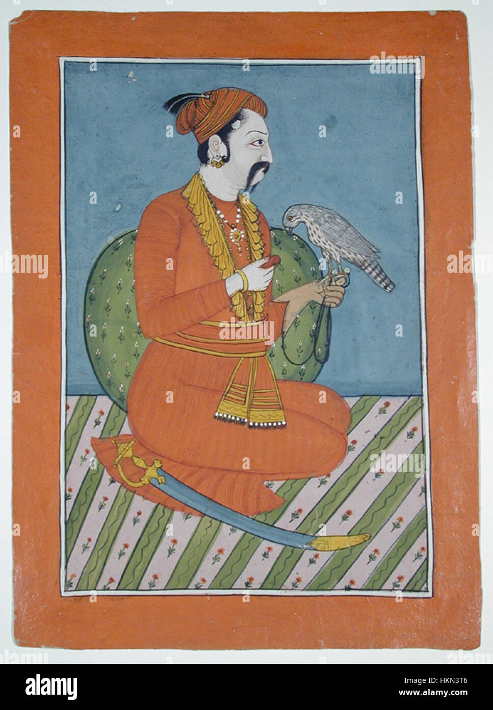 This artwork depicts a kneeling raja with his falcon, a symbol of power ...