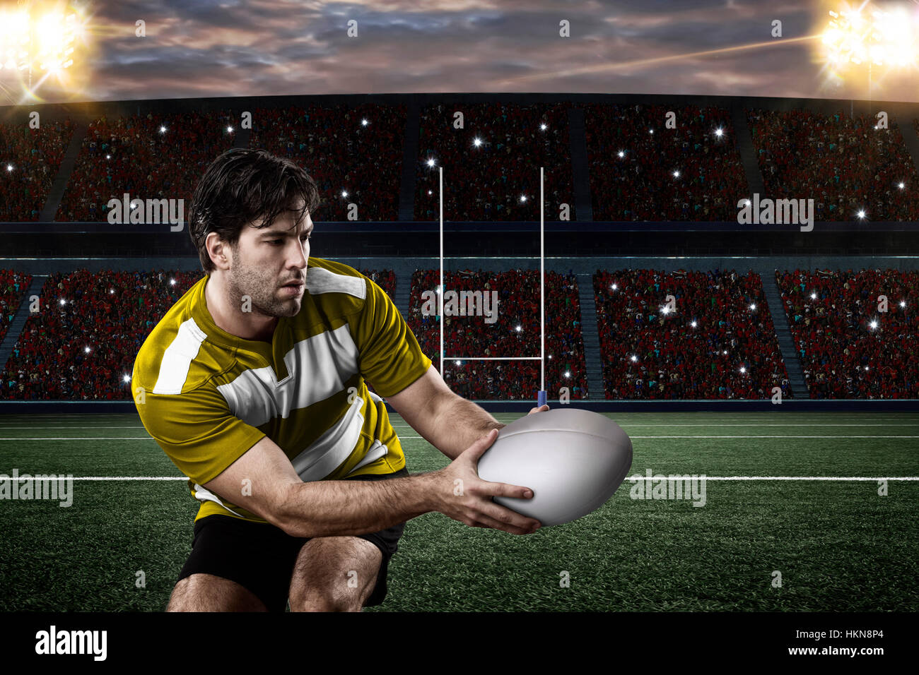 Rugby player in a yellow uniform on a stadium Stock Photo - Alamy