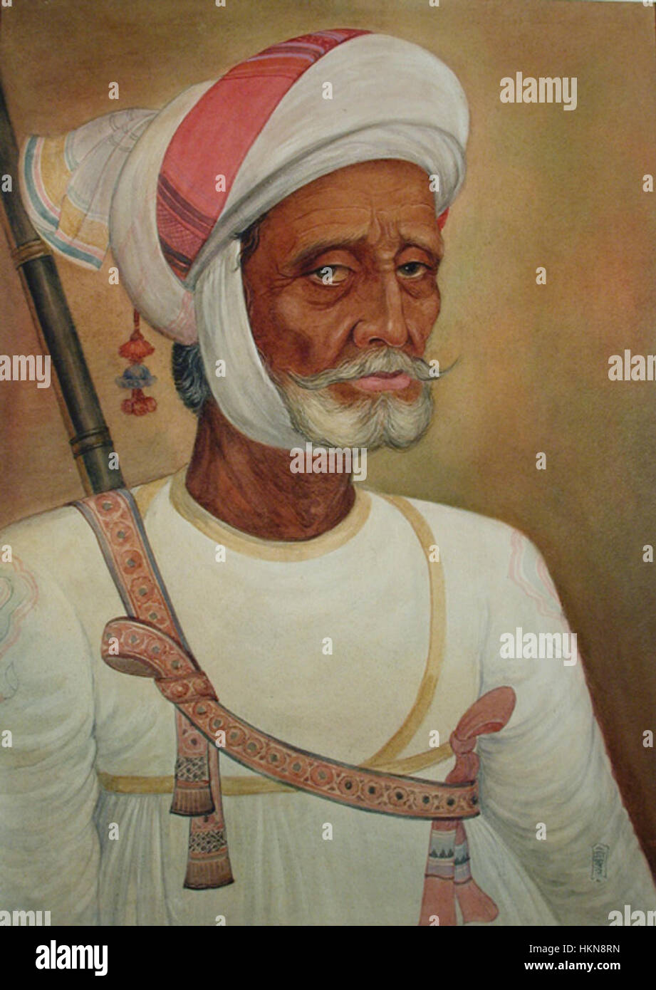 This portrait depicts an elderly Rajput man wearing a traditional white ...