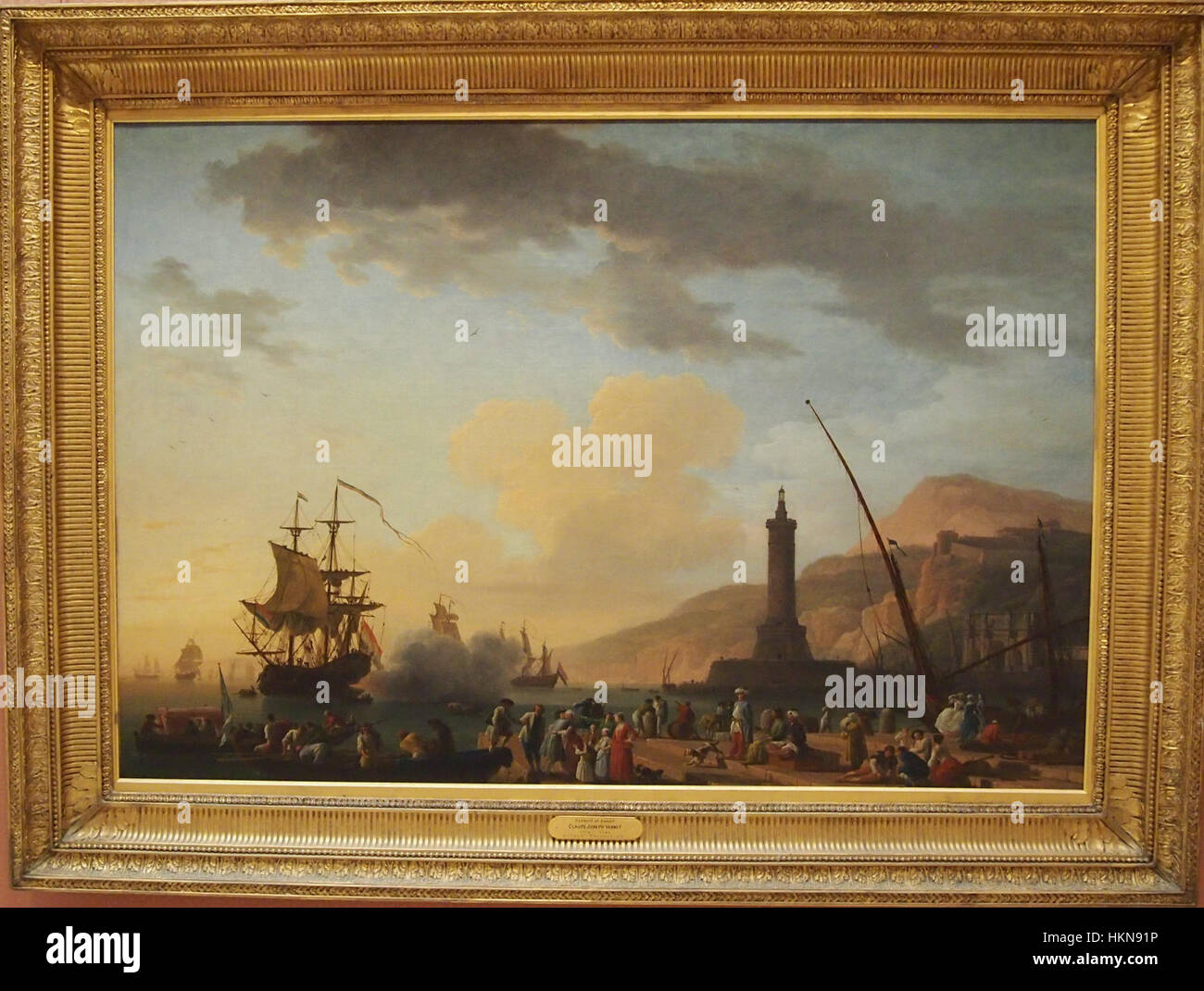 This painting, 'A Seaport at Sunset', captures the serene beauty of a ...