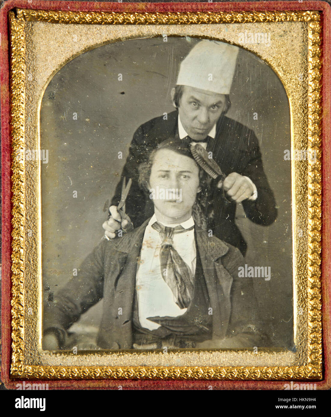 'Barber and His Client,' painted by William Knapp around 1850, depicts ...