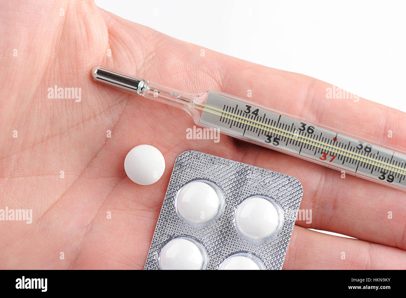pill from flu and cold on hand on white background Stock Photo - Alamy
