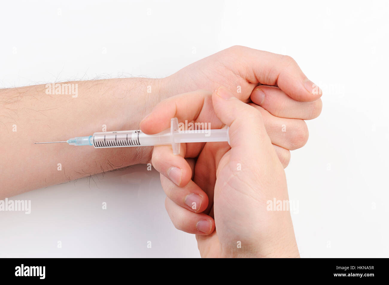 shot syringe in hand on white background Stock Photo - Alamy