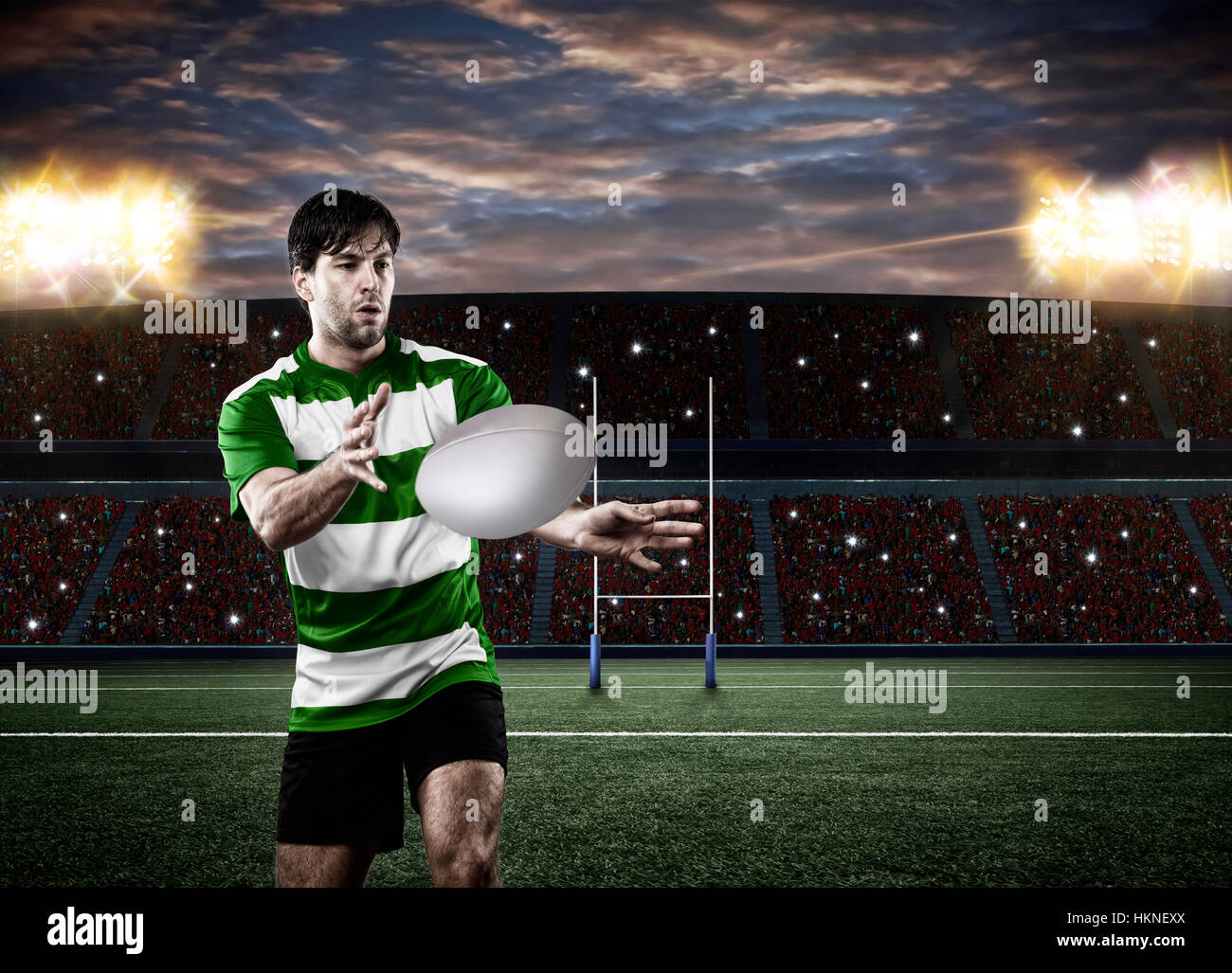 Rugby player in a green uniform on a stadium Stock Photo - Alamy
