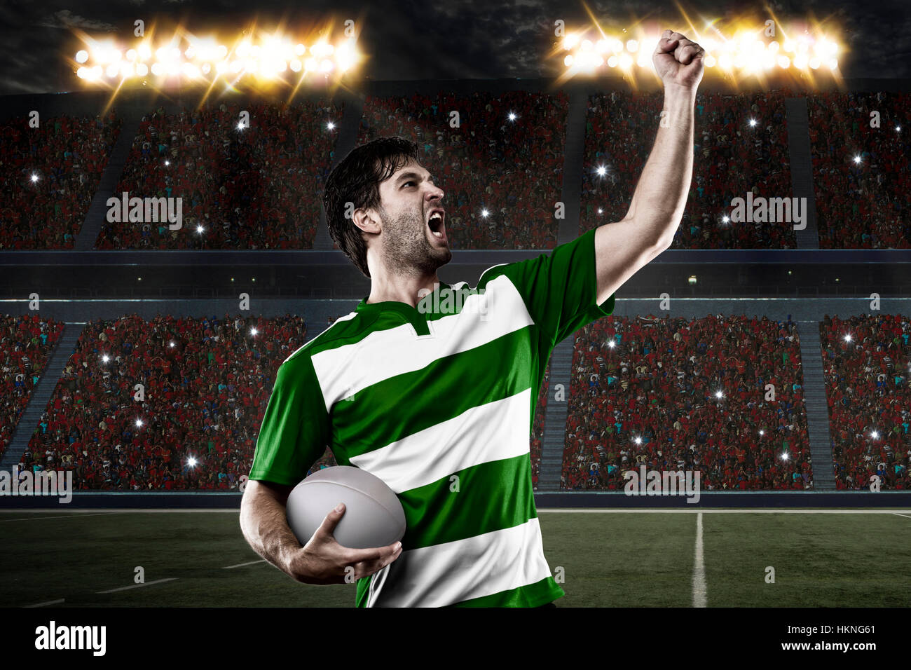 Rugby player in a green uniform celebrating on a stadium Stock Photo ...