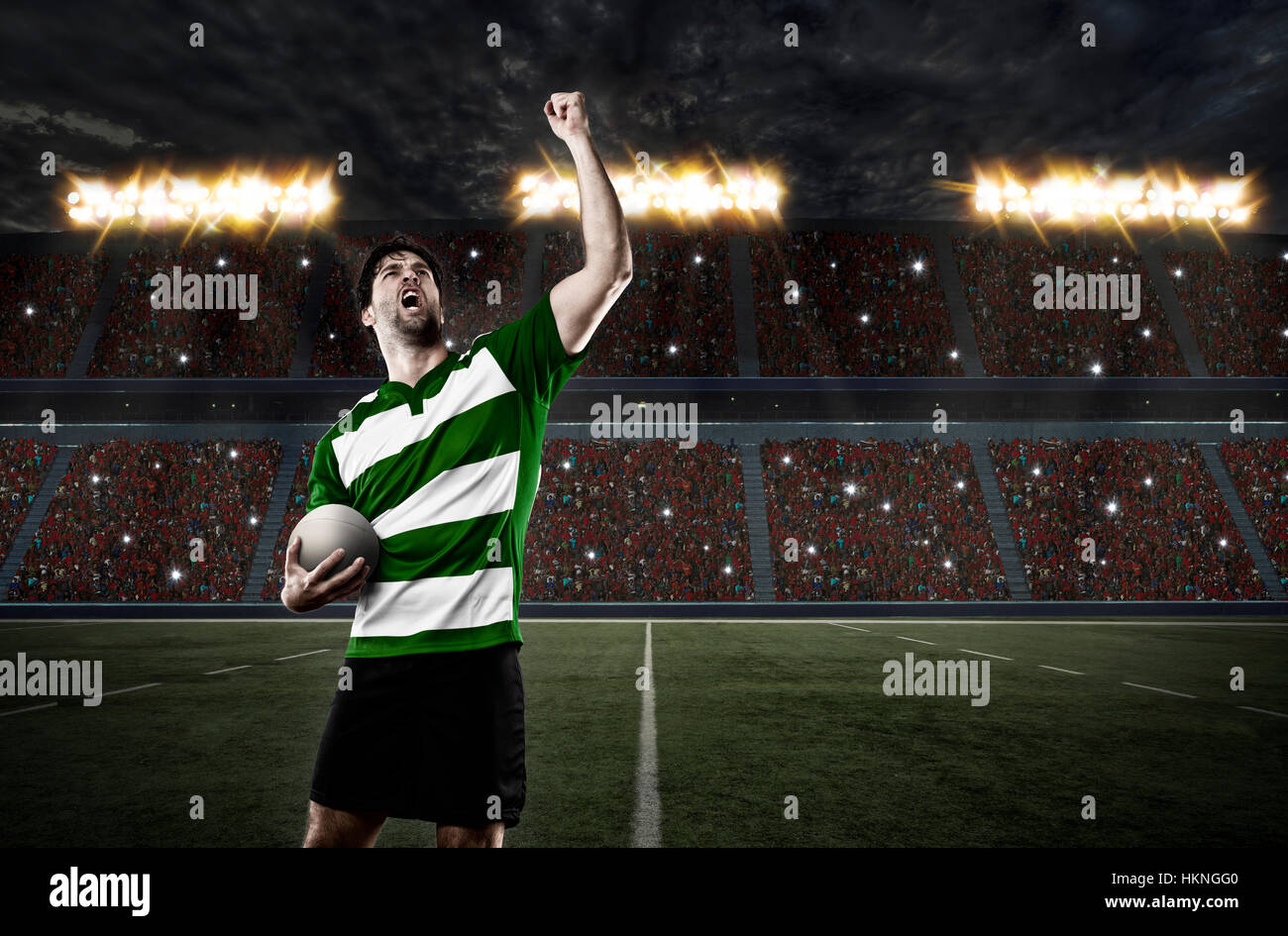 Rugby player in a green uniform celebrating on a stadium Stock Photo ...