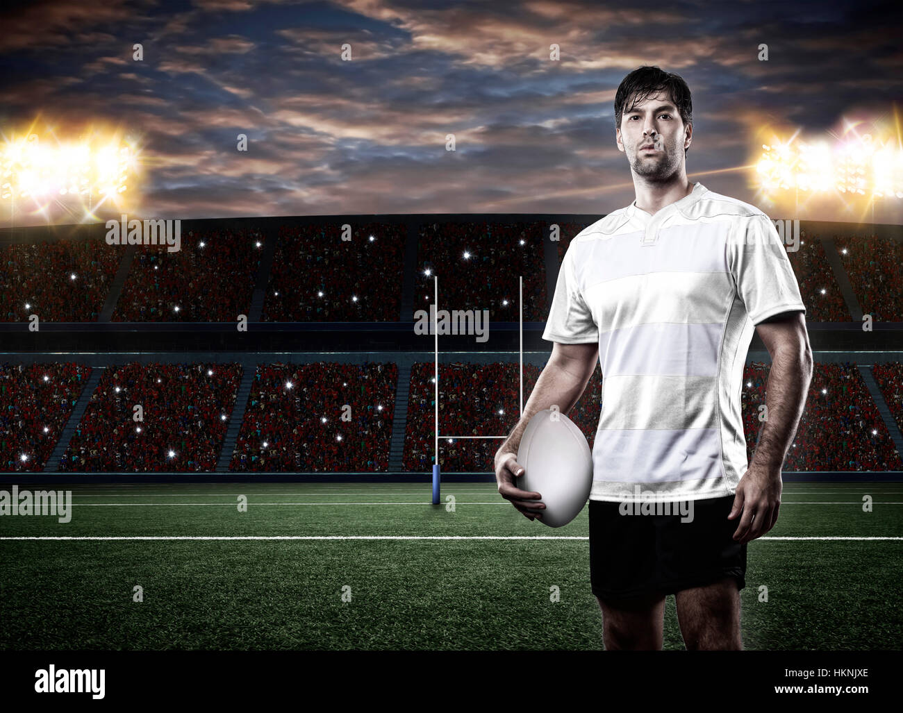 Rugby player in a white uniform on a stadium Stock Photo - Alamy