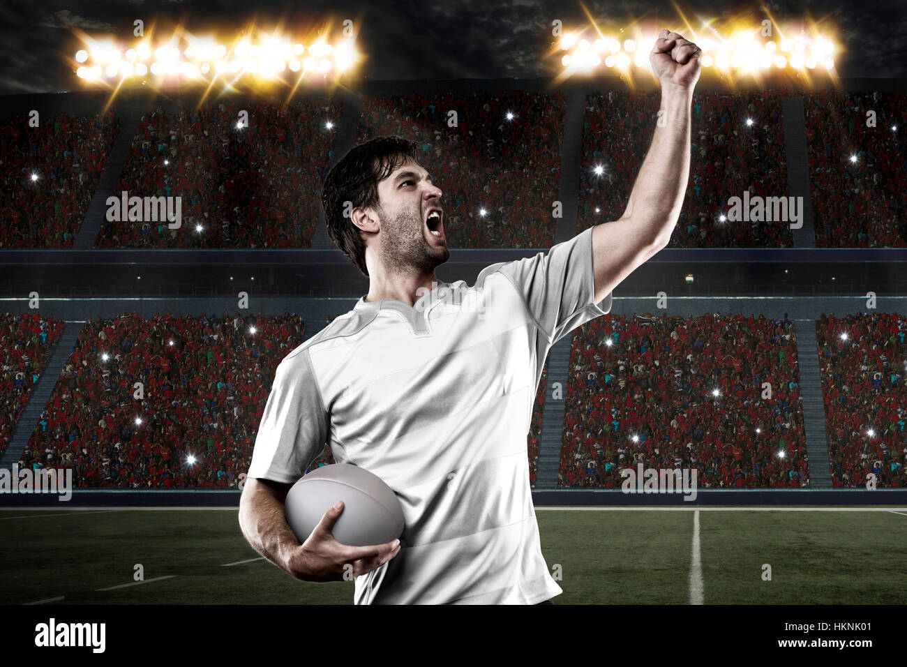Rugby player in a white uniform celebrating on a stadium Stock Photo ...