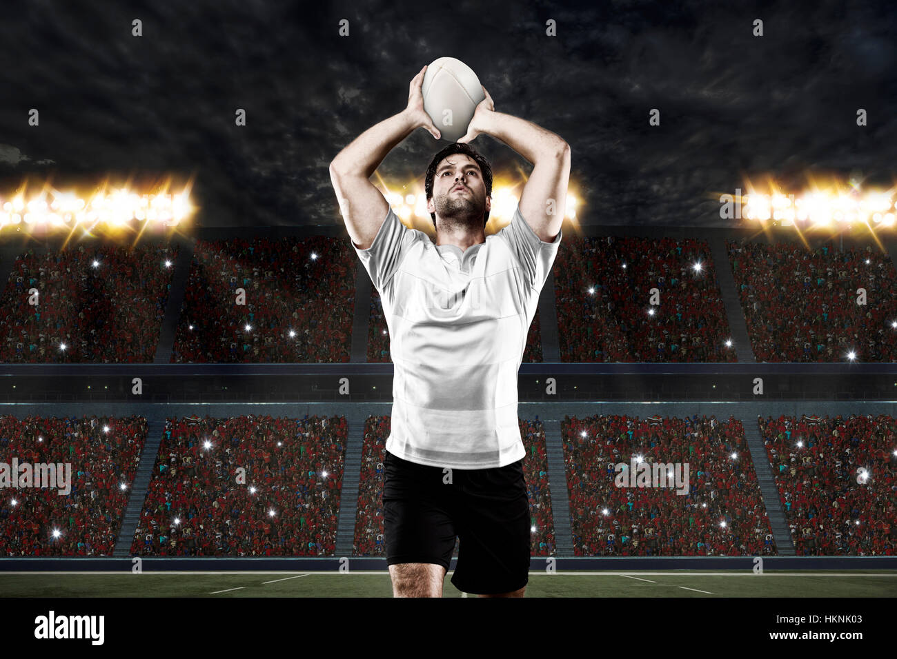 Rugby player in a white uniform on a stadium Stock Photo - Alamy