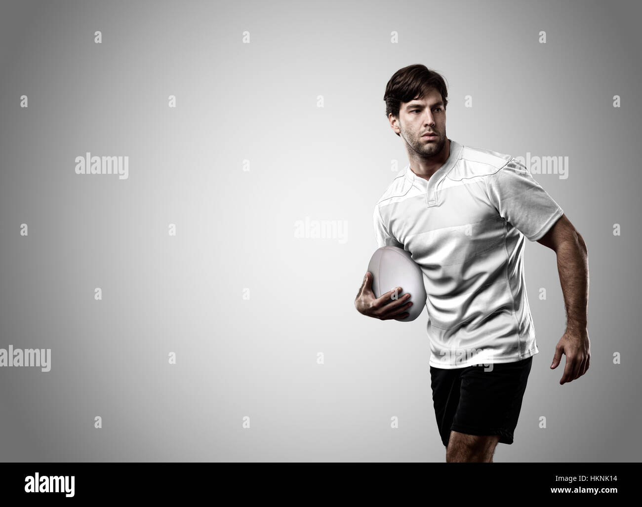 Rugby player in a white uniform on a white background Stock Photo - Alamy