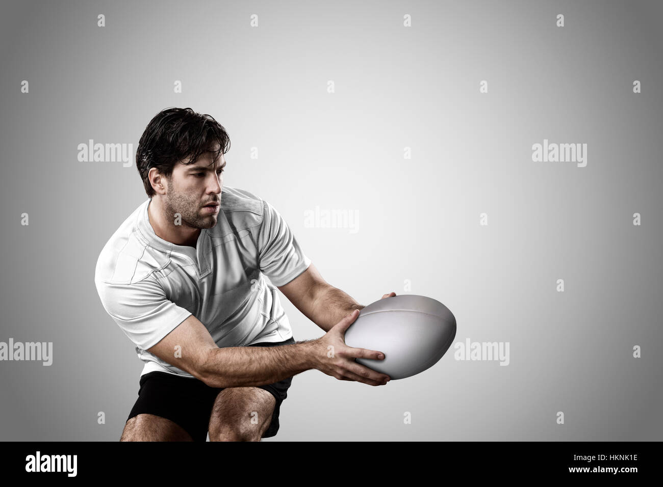 Rugby player in a white uniform on a white background Stock Photo - Alamy