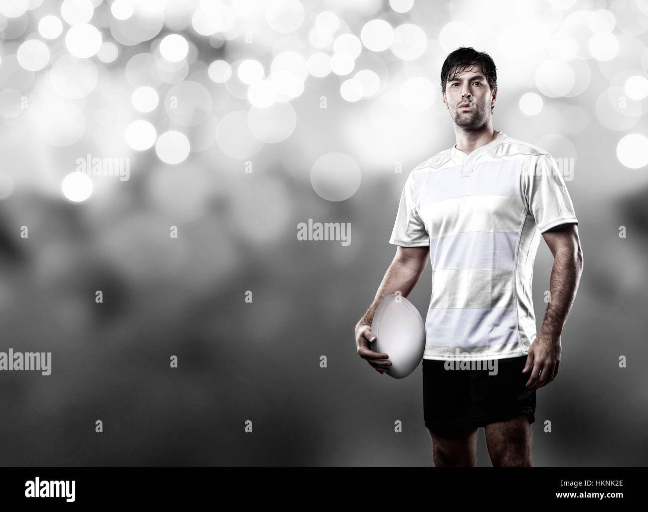 Rugby player in a white uniform on a white lights background Stock ...