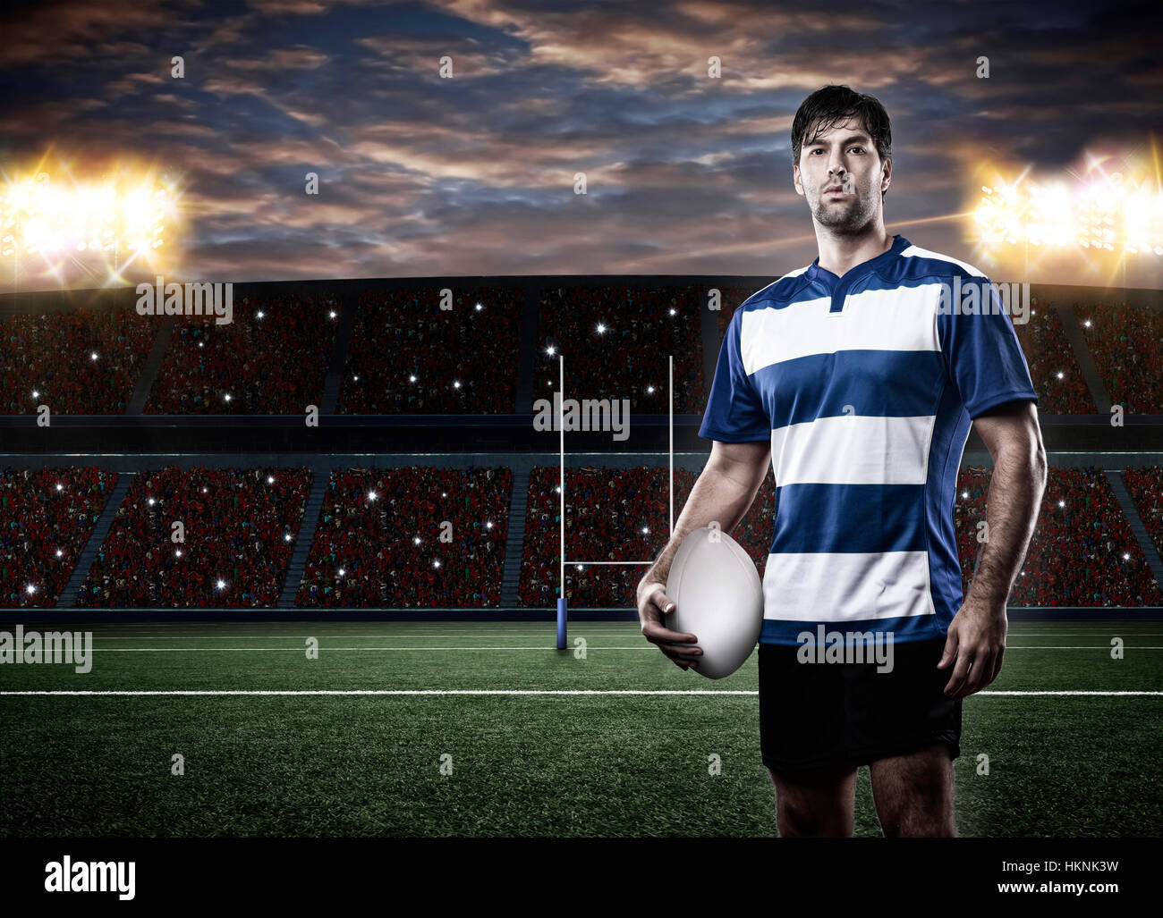 Rugby player in a blue uniform on a stadium Stock Photo - Alamy