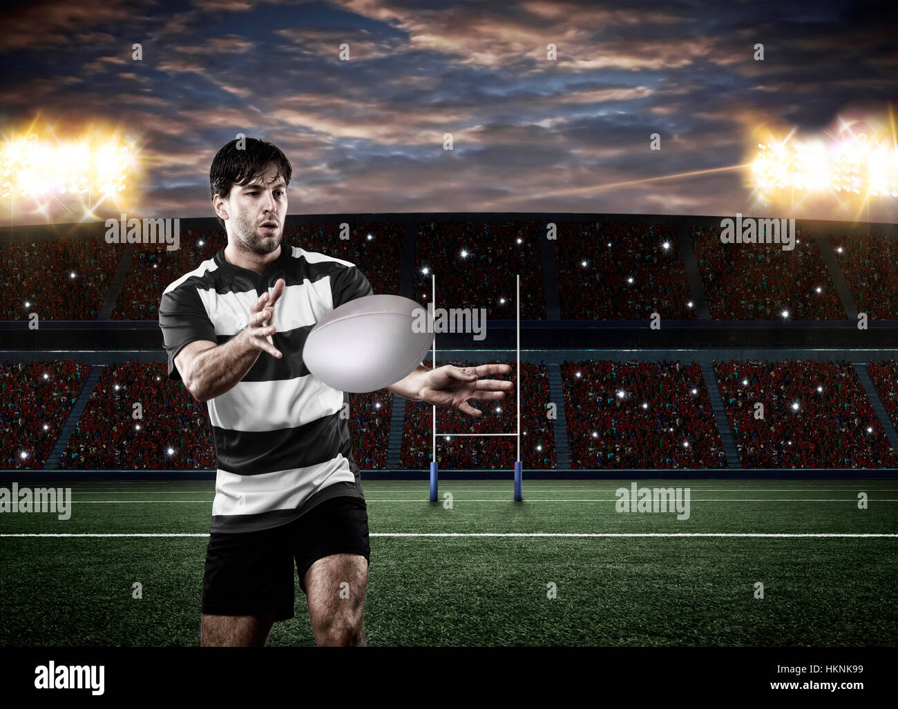 Rugby player in a black uniform on a stadium Stock Photo - Alamy