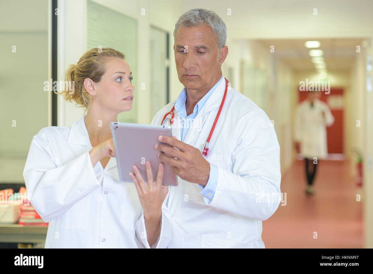 Two doctors conferring Stock Photo - Alamy