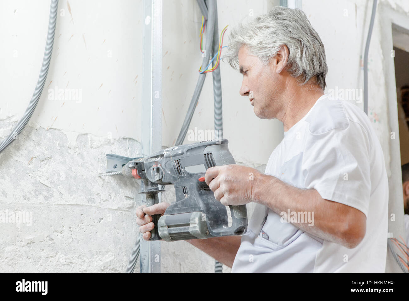 Worker using pneumatic drill hi-res stock photography and images - Alamy