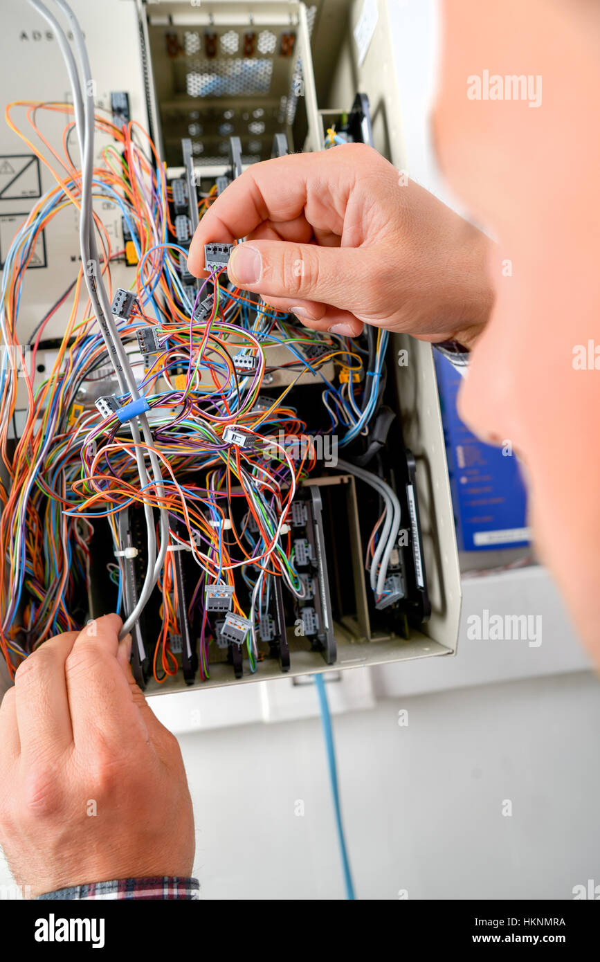 Attempting to repair a fusebox Stock Photo - Alamy