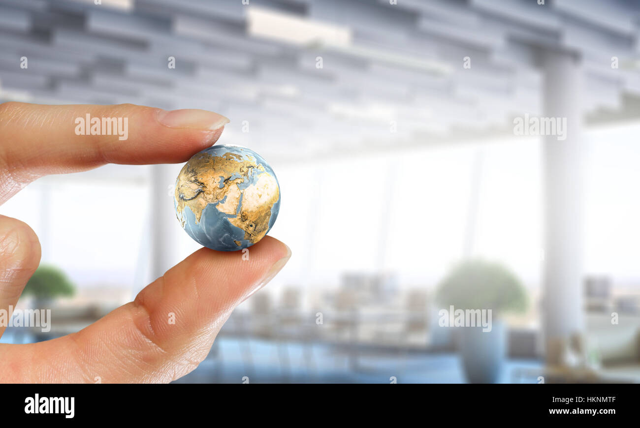 Small Earth planet ball between female fingers. Elements of this image ...