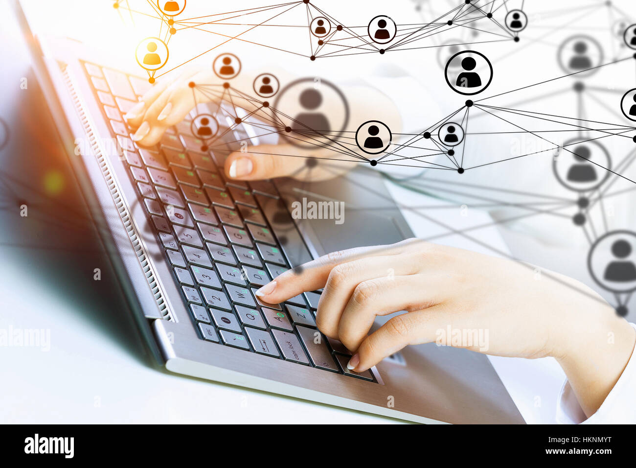 Hands of businesswoman working on laptop presenting social connection ...