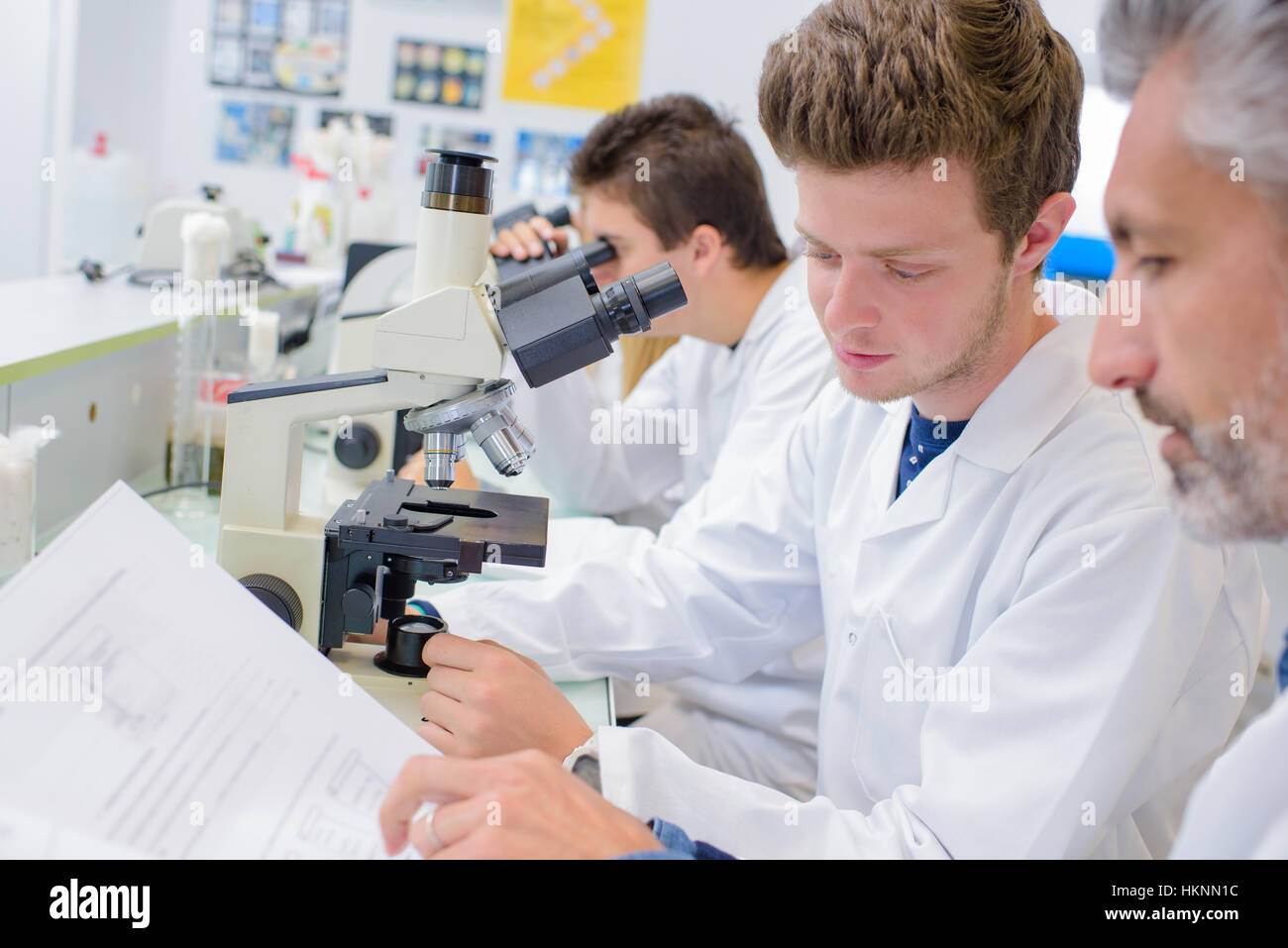 Row of students in science lesson Stock Photo - Alamy
