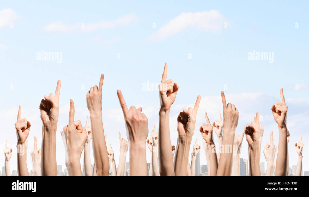 Row of raised hands showing different gestures Stock Photo - Alamy