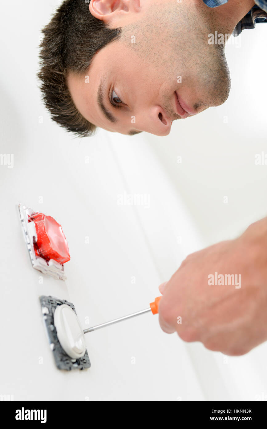 Electrician fitting a socket Stock Photo - Alamy