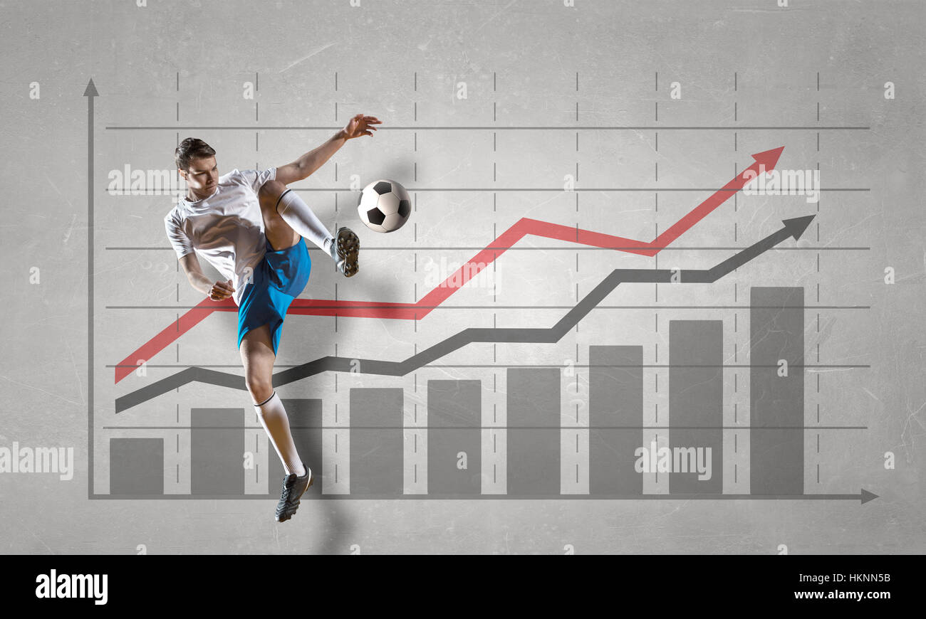 Football player kicking ball and graphs at background. Mixed media ...