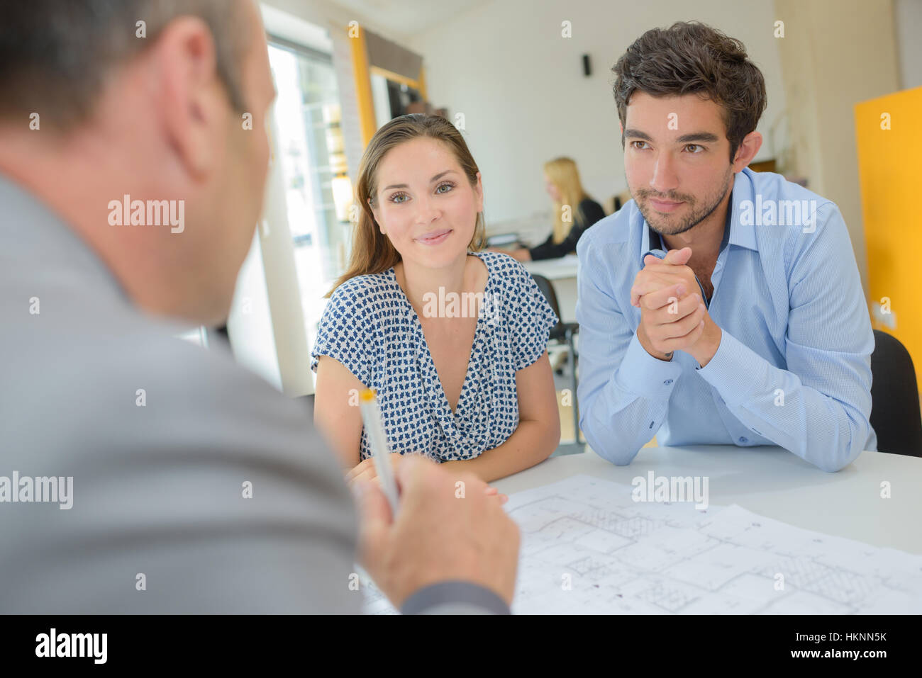Young couple in meeting with property developer Stock Photo - Alamy