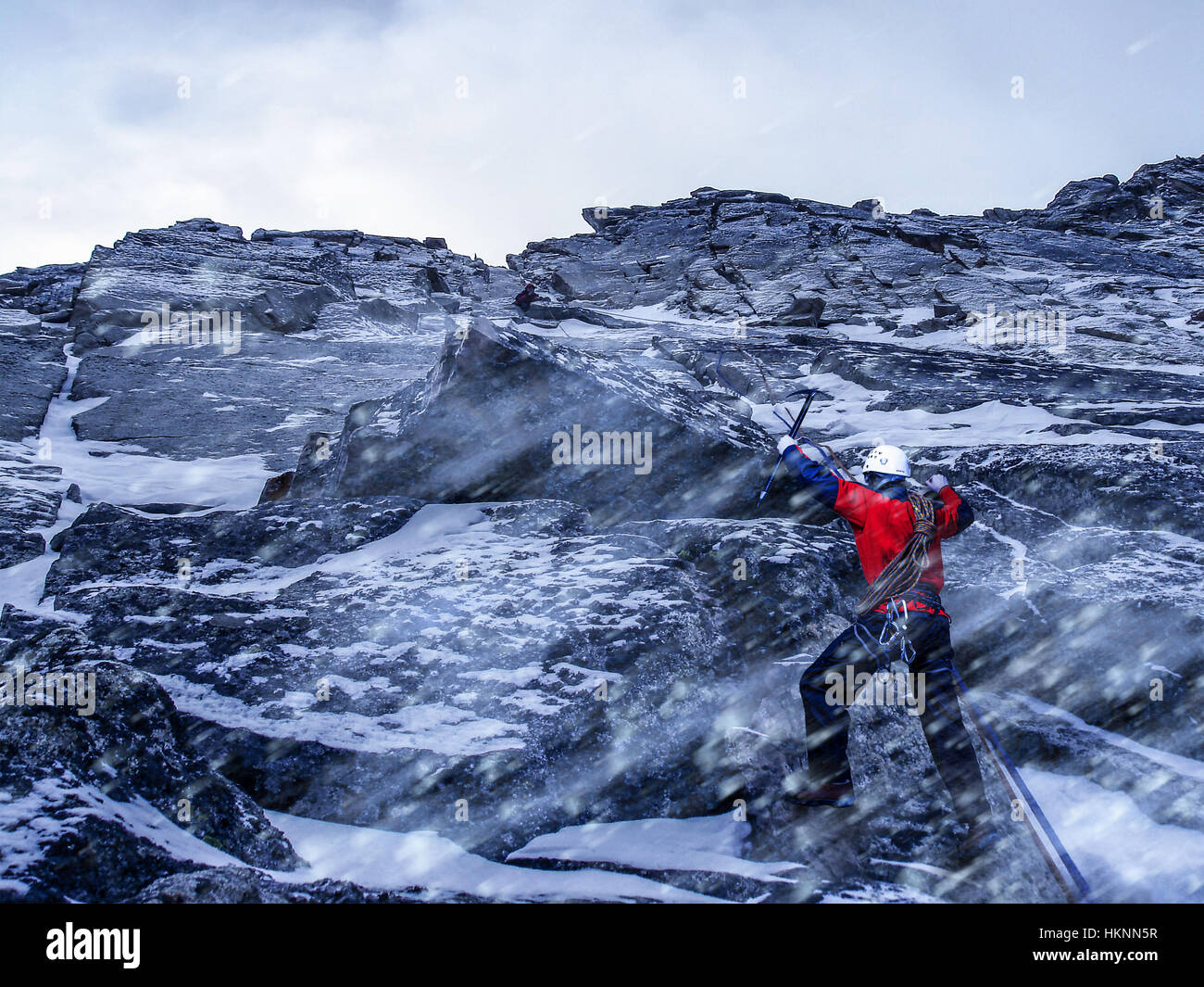 Young brave man alpinist climbing dangerous cliff Stock Photo - Alamy