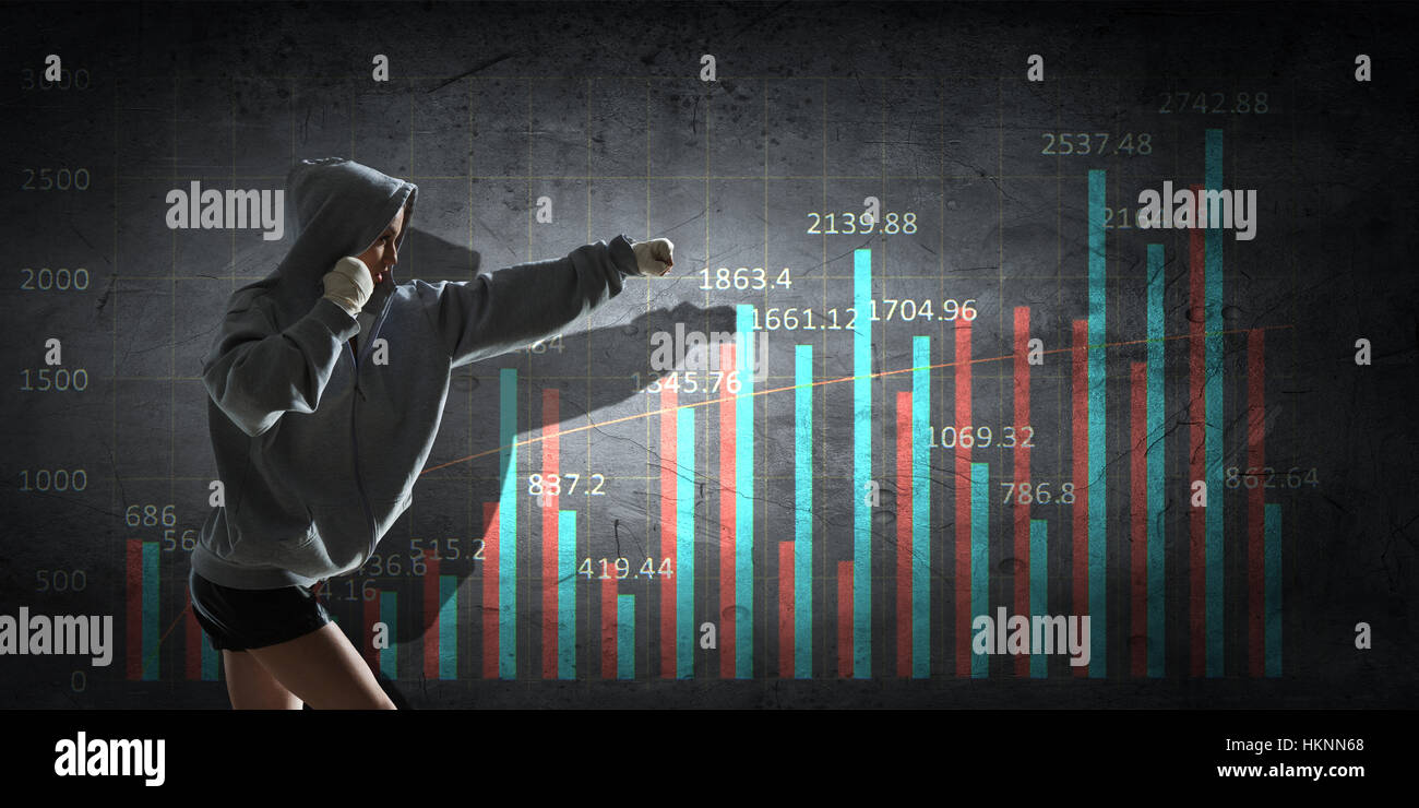 Young woman boxing against graphs background. Mixed media Stock Photo ...