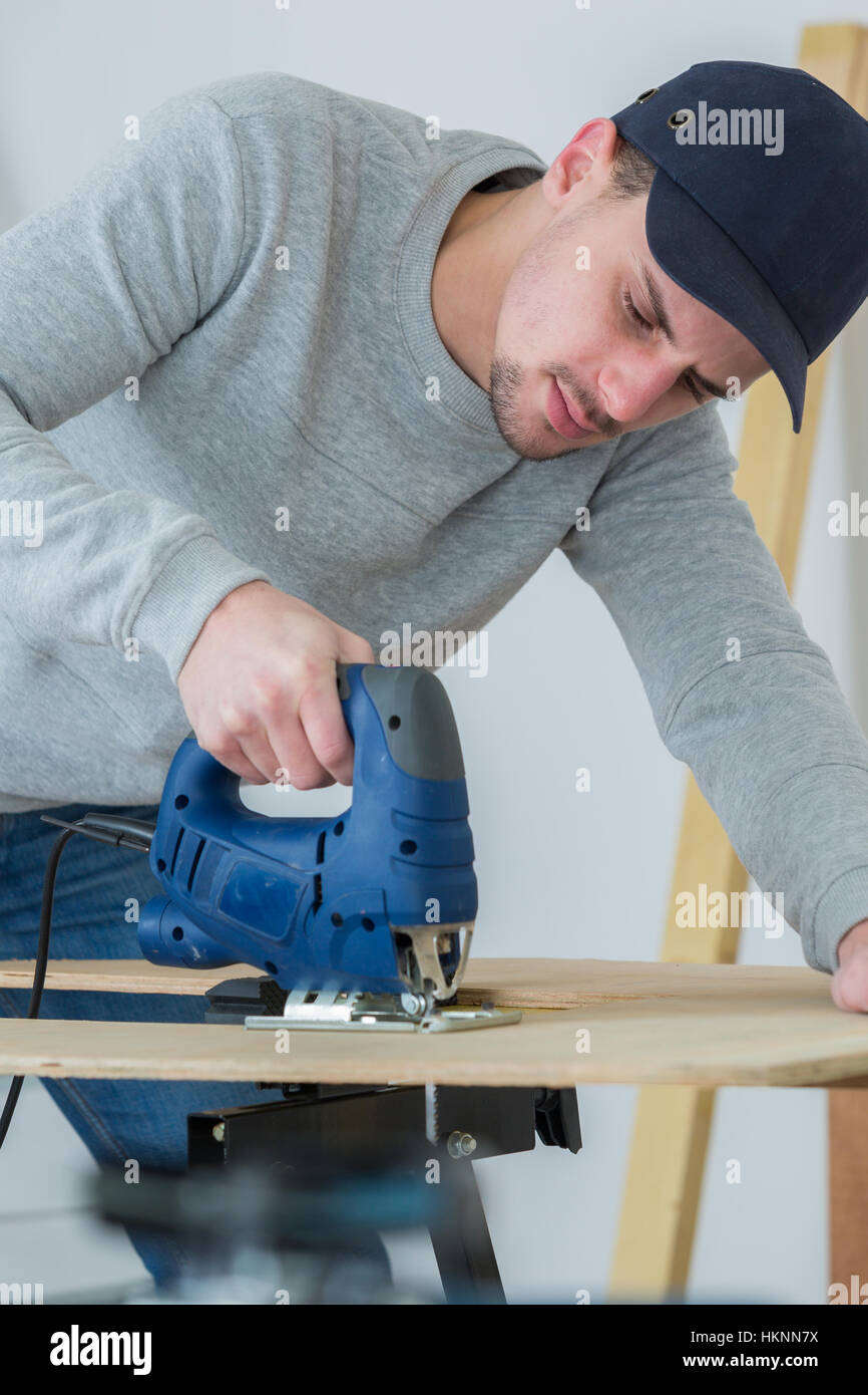 Man using electric jigsaw Stock Photo - Alamy