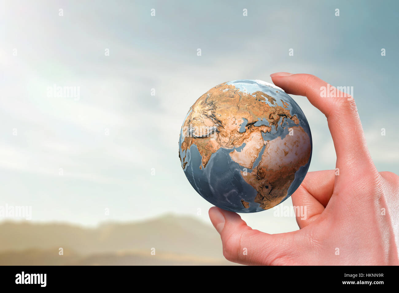 Small Earth planet ball between female fingers. Elements of this image ...