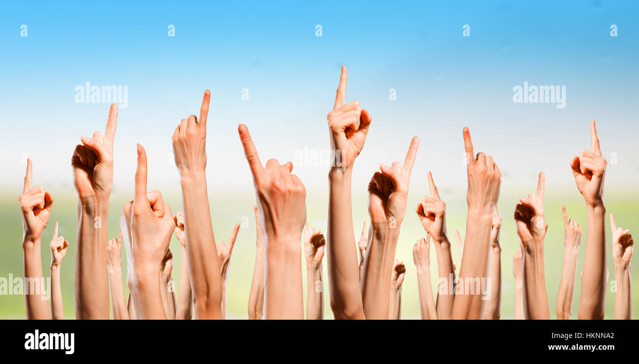 Row of raised hands showing different gestures Stock Photo - Alamy