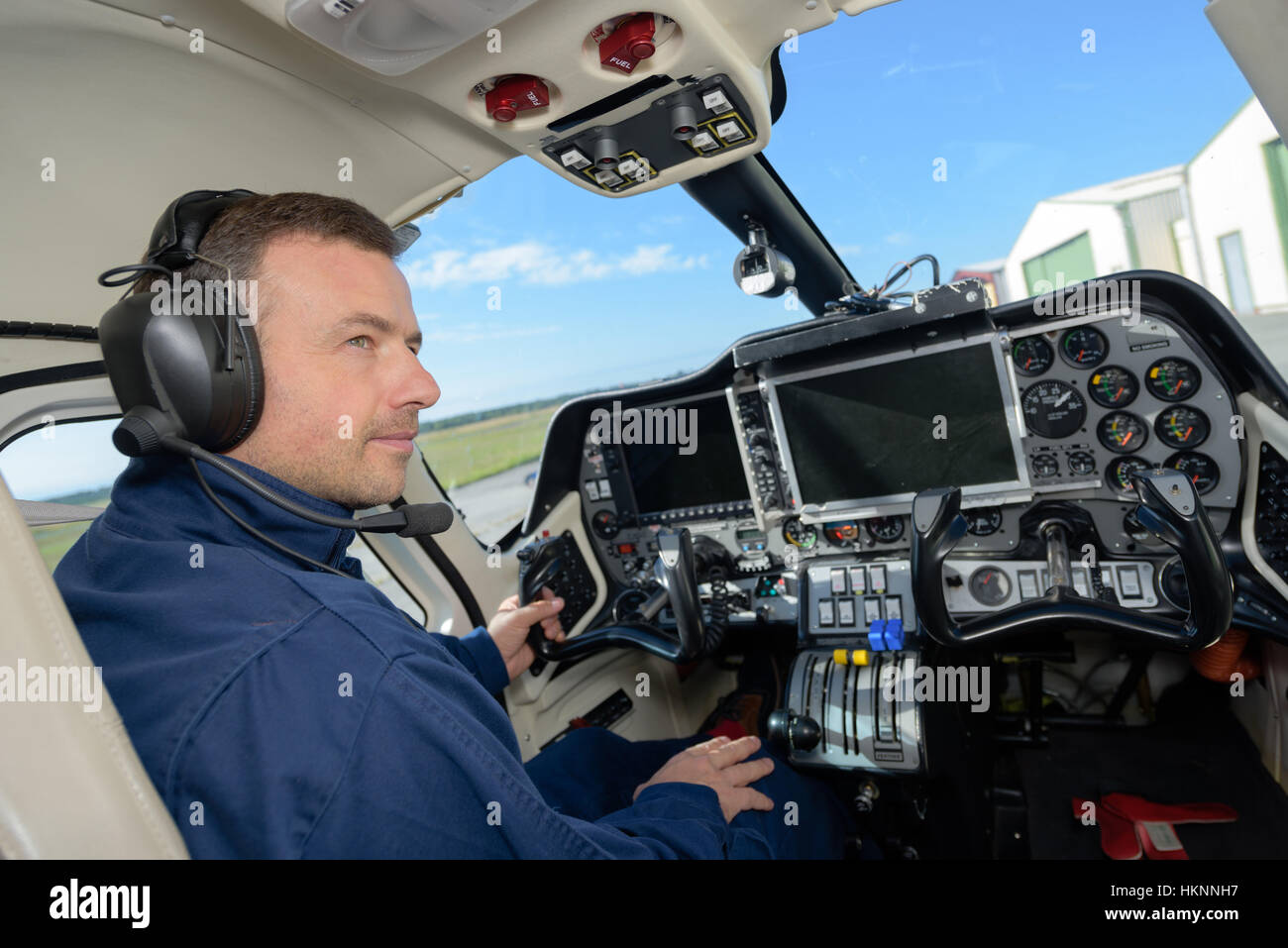 Man in cockpit of aircraft Stock Photo - Alamy