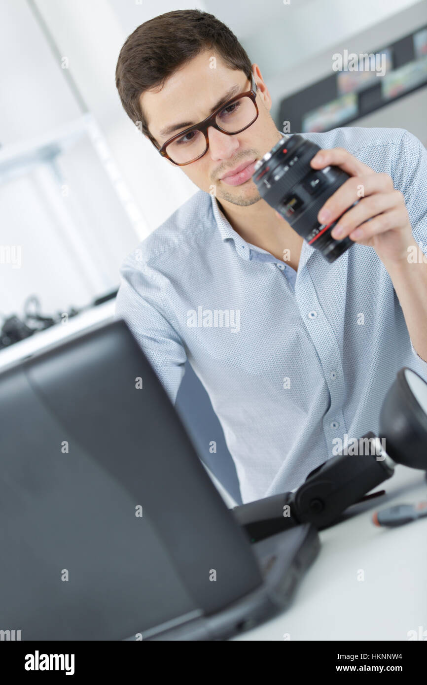 man engineer developping new camera lense Stock Photo - Alamy