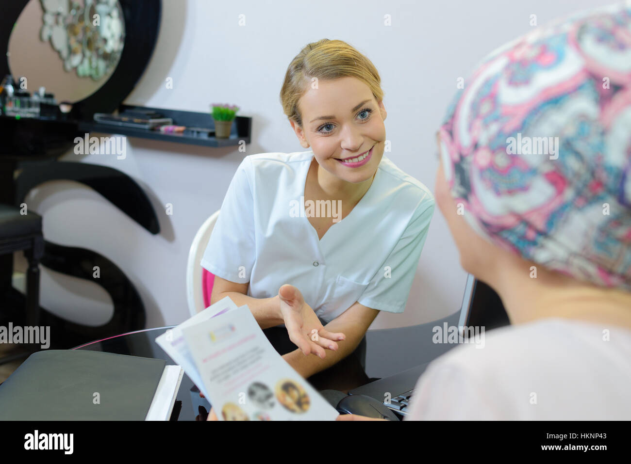 female client in beauty salon with a beautician Stock Photo - Alamy