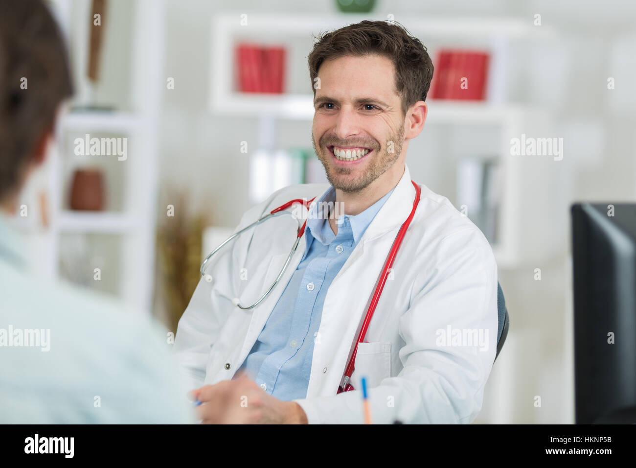 portrait of friendly male doctor smiling Stock Photo - Alamy